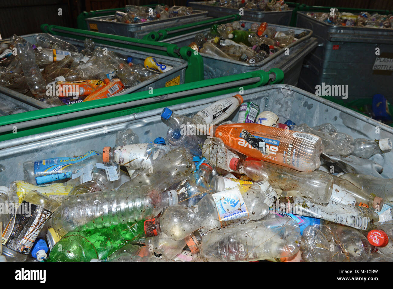 Bins full of wasted discarded plastic bottles from the road side Stock ...