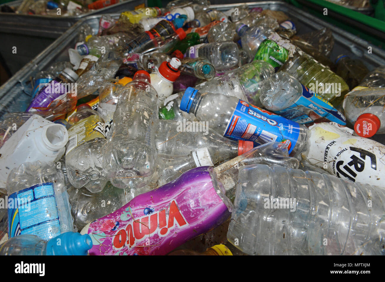 Bins full of wasted discarded plastic bottles from the road side Stock ...