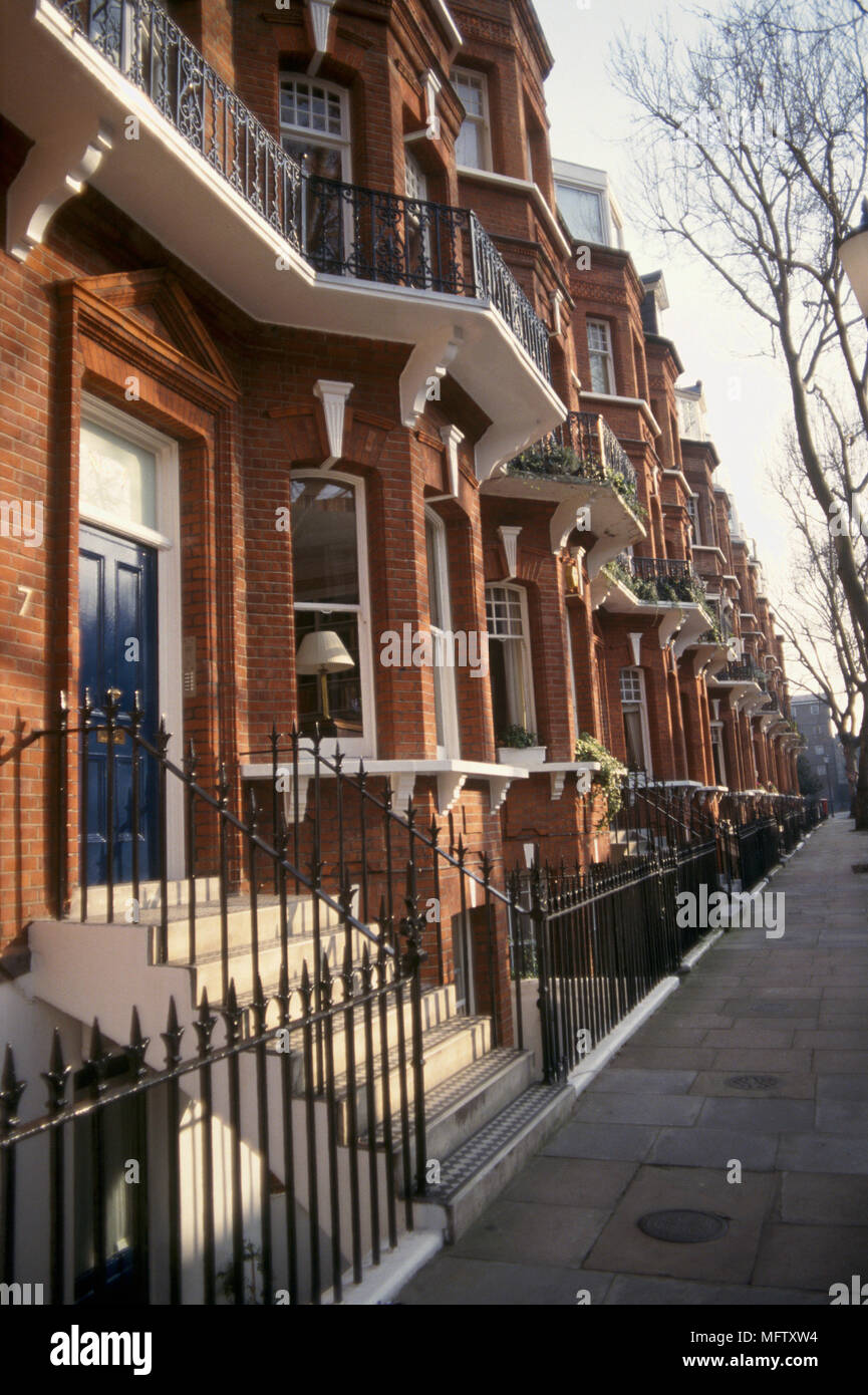The exterior of a row of terraced red brick Victorian mansion town ...