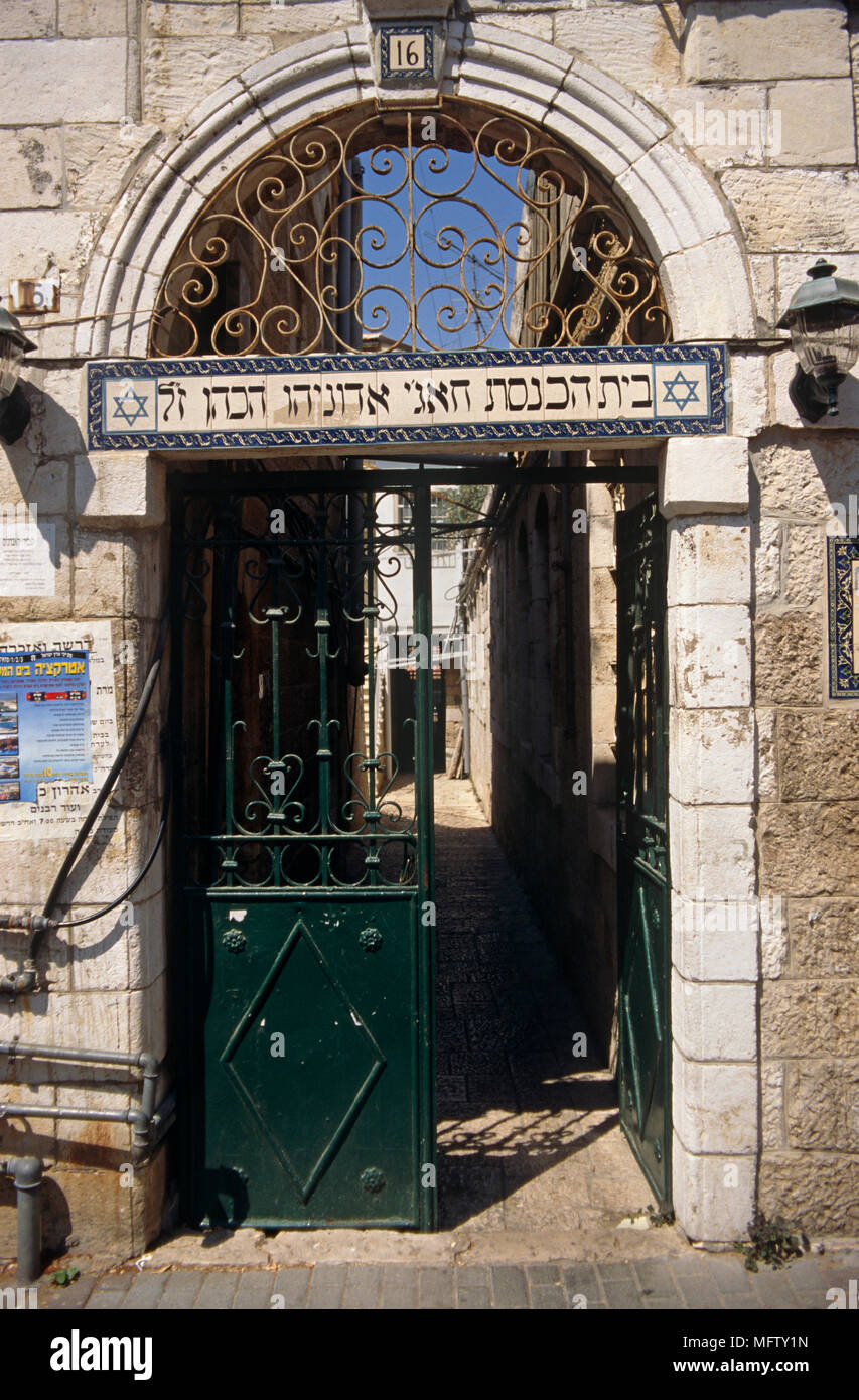 Exterior of green painted gateway with metal gates Stock Photo - Alamy
