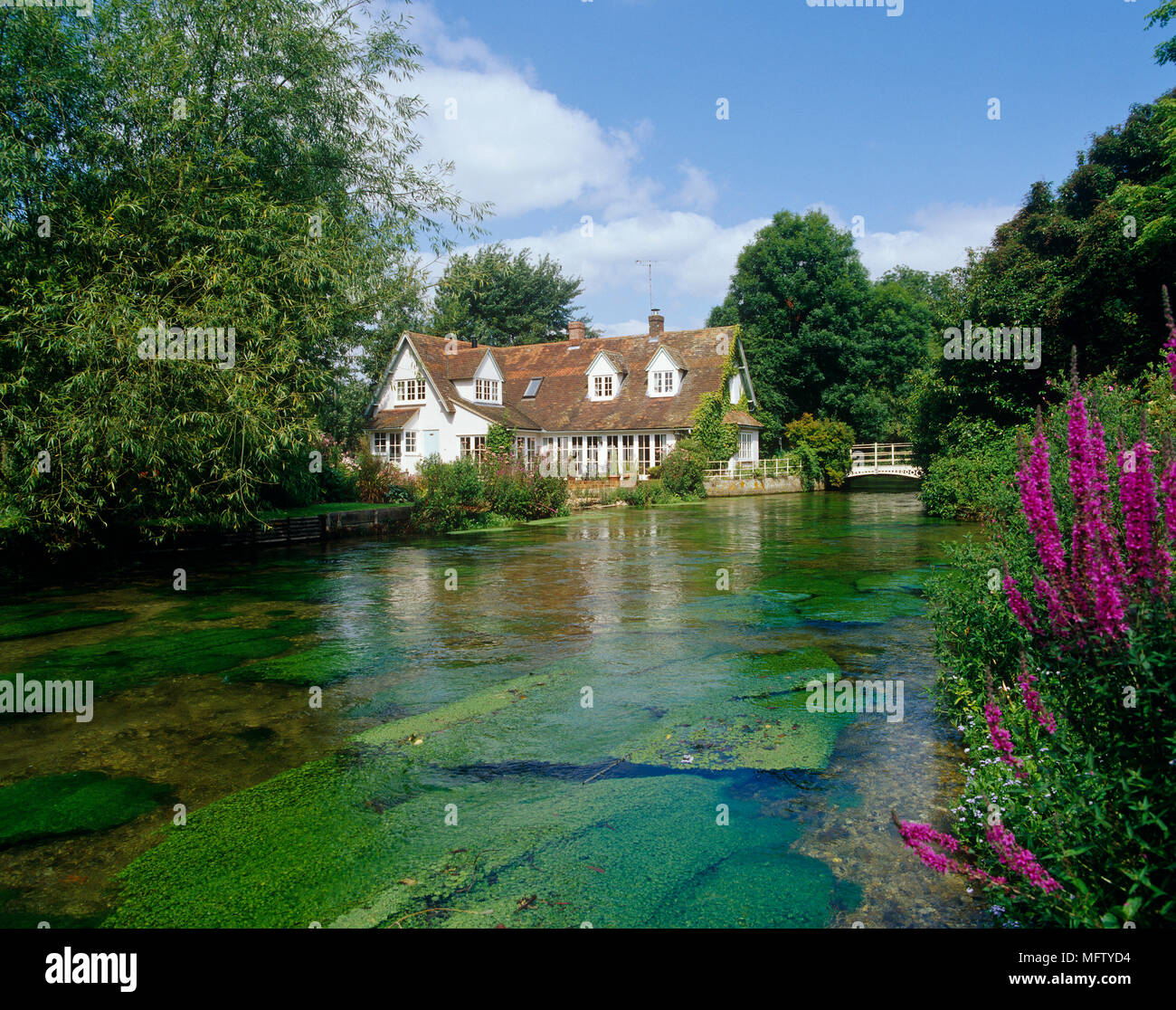 Exterior of riverside country house Stock Photo - Alamy