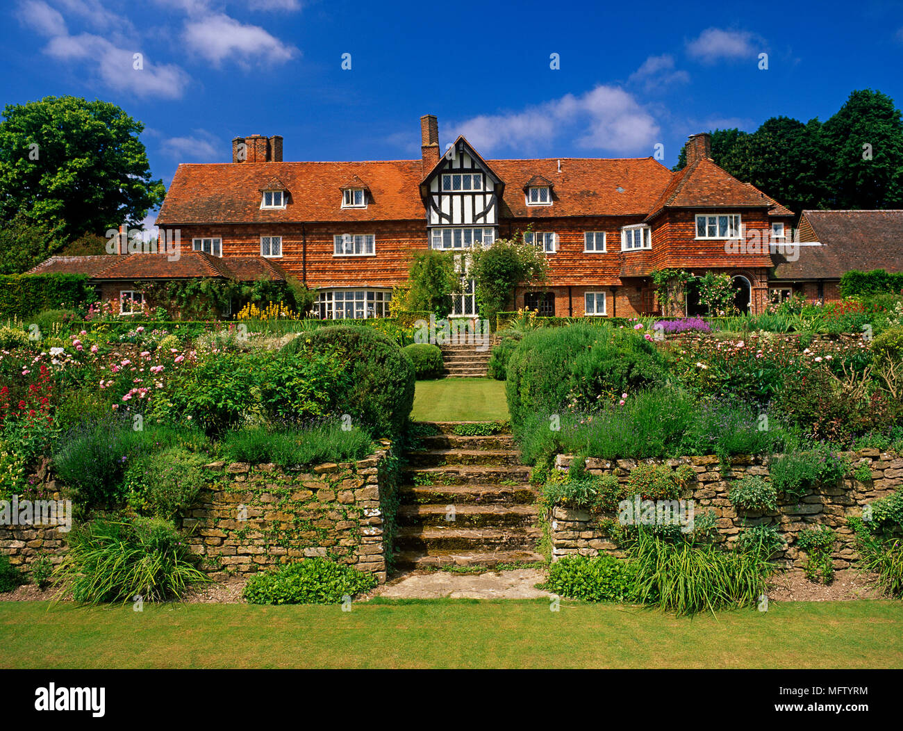 Exterior of country house with terraced garden and dry stone wall Stock ...
