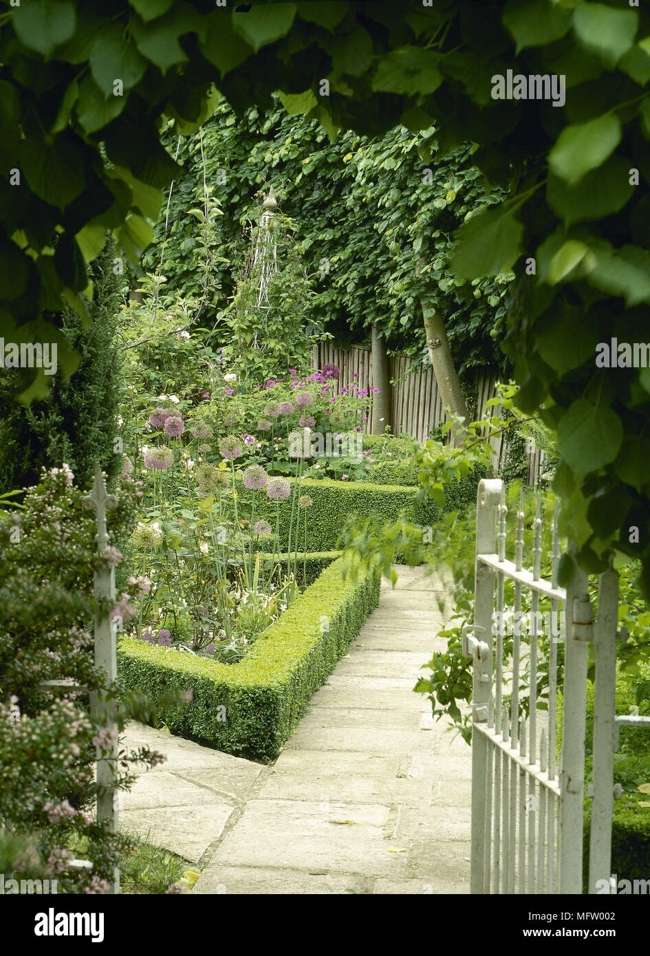 Garden metal gate path flower border low clipped hedging Gardens detail ...