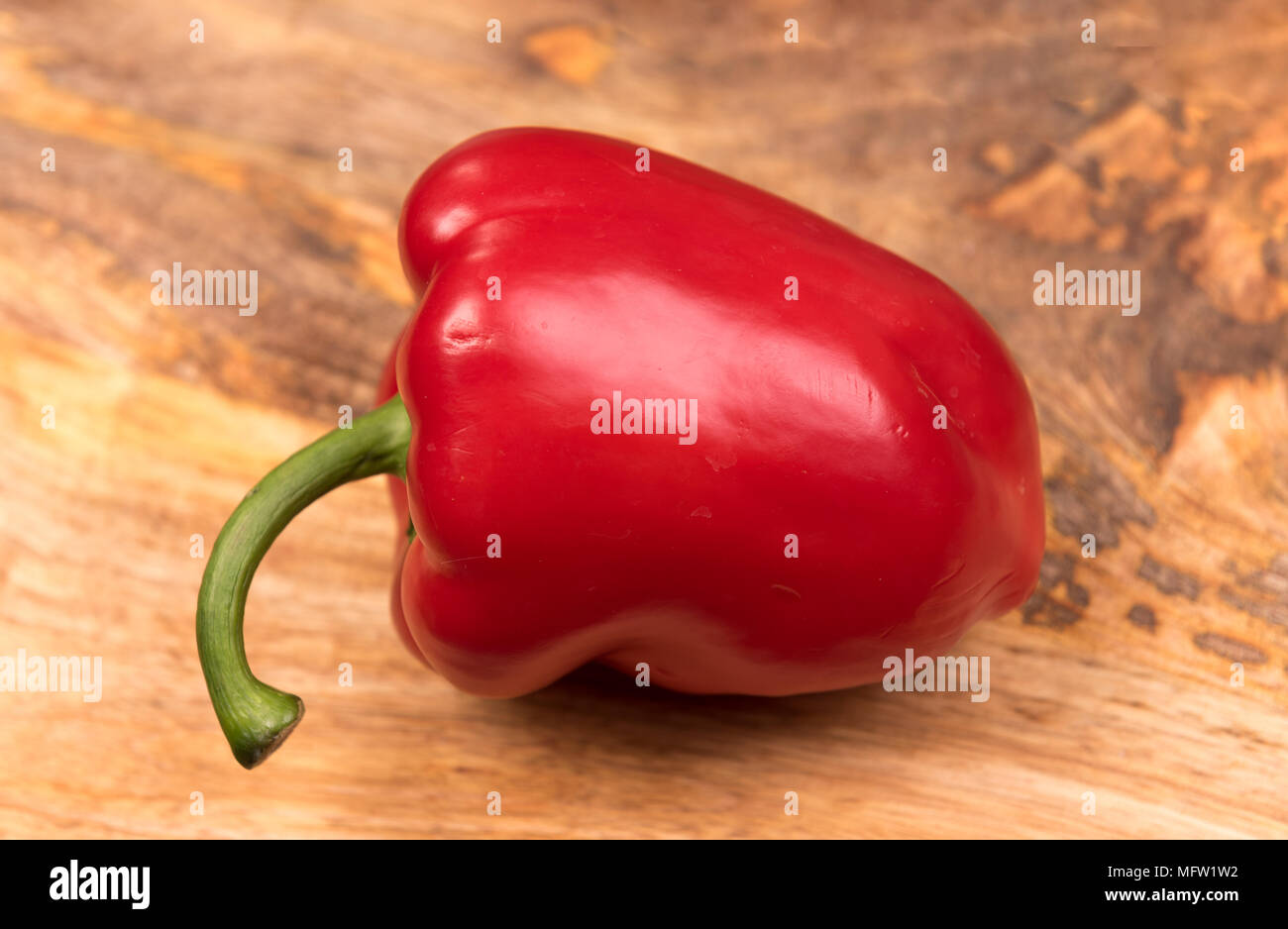 fresh peppers on a background of mango boards Stock Photo - Alamy