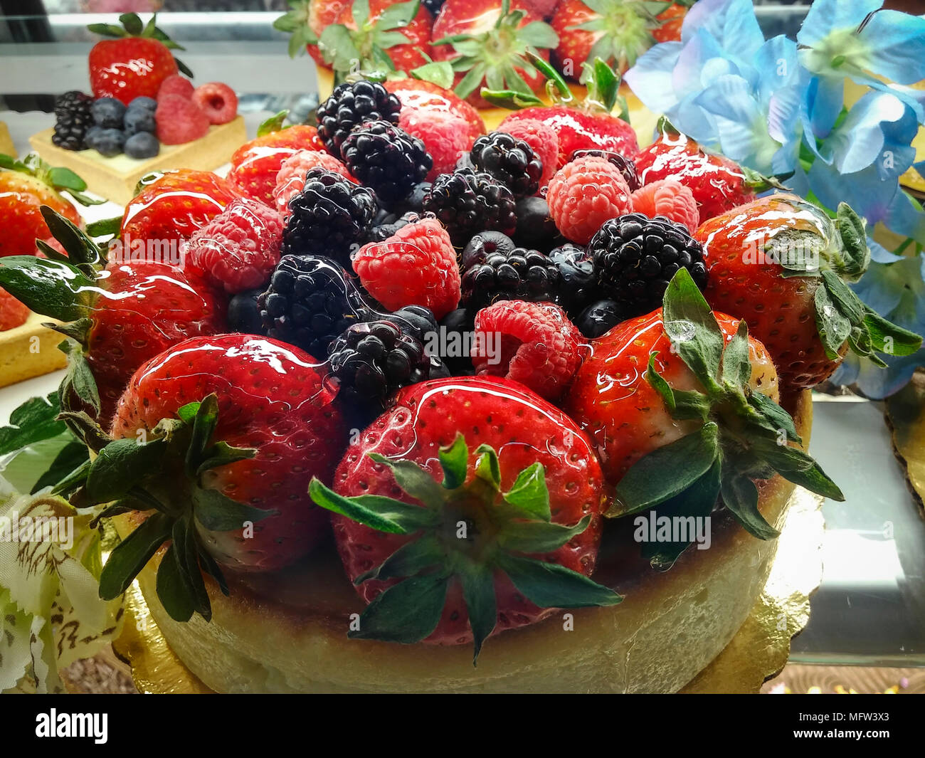 A fruit tart in a bakery display case in New York on Tuesday, April 17 ...