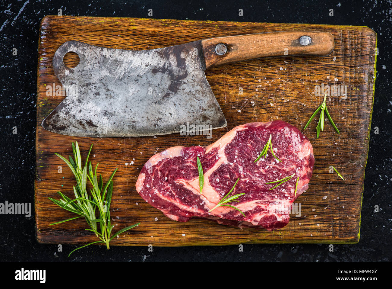 Butcher axe and piece of beef meat steak Stock Photo - Alamy