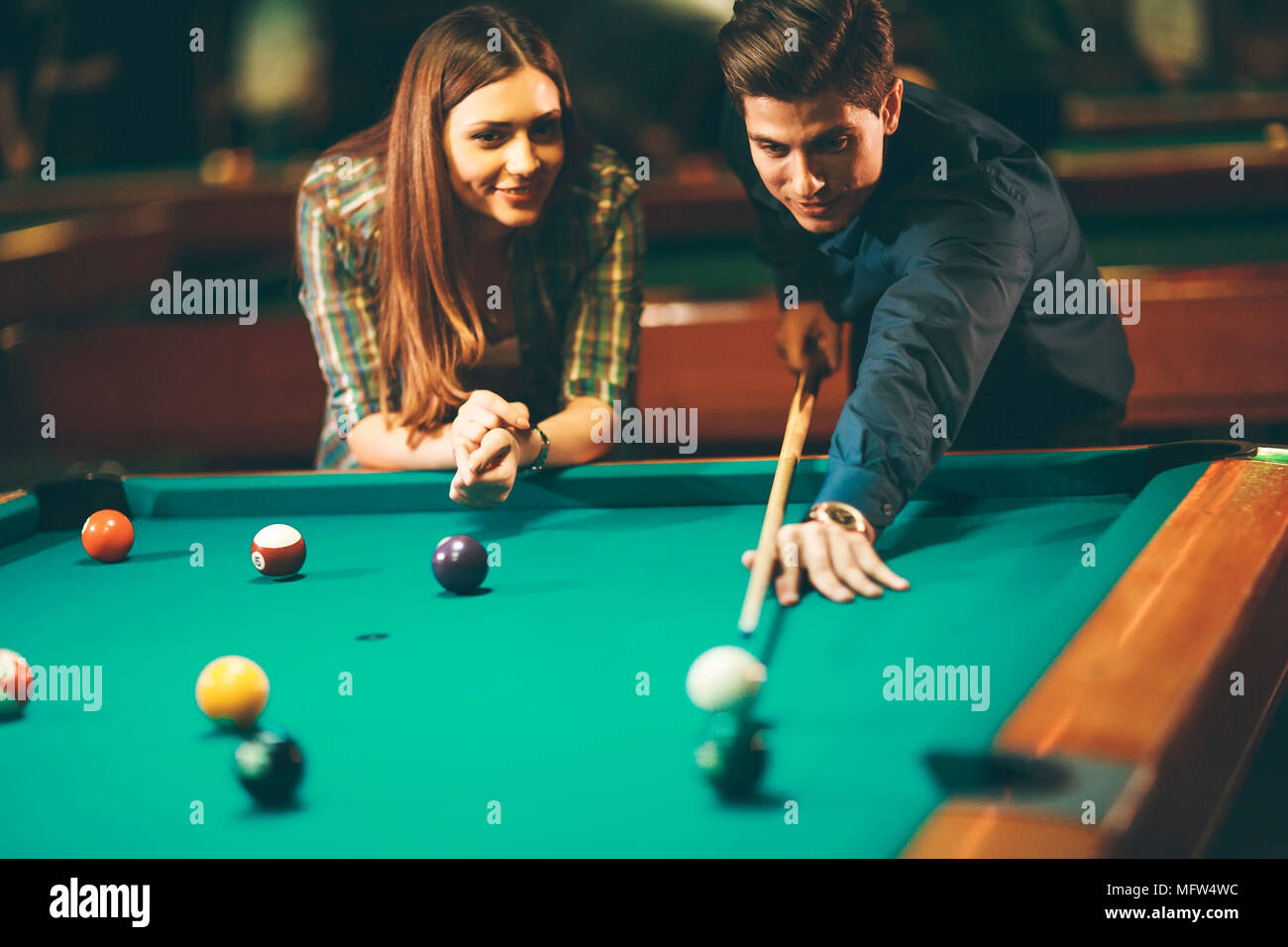Couple shooting pool together hi-res stock photography and images - Alamy