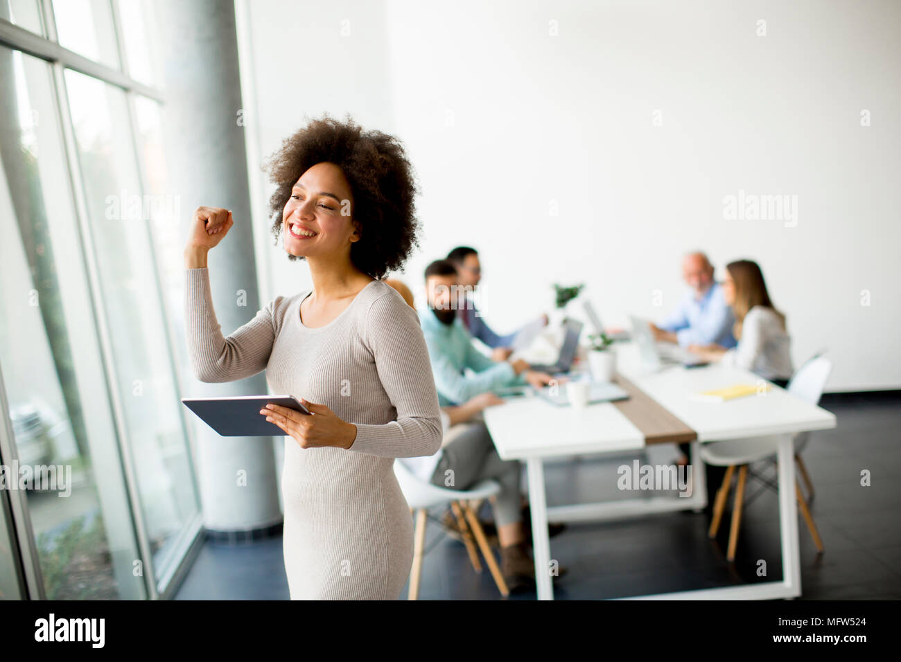 Typical business day at a modern company with multiethnic group of ...