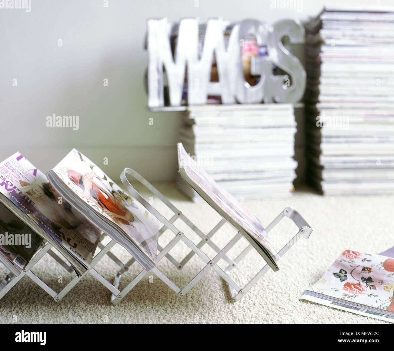 Modern steel magazine storage rack Interiors detail Stock Photo - Alamy
