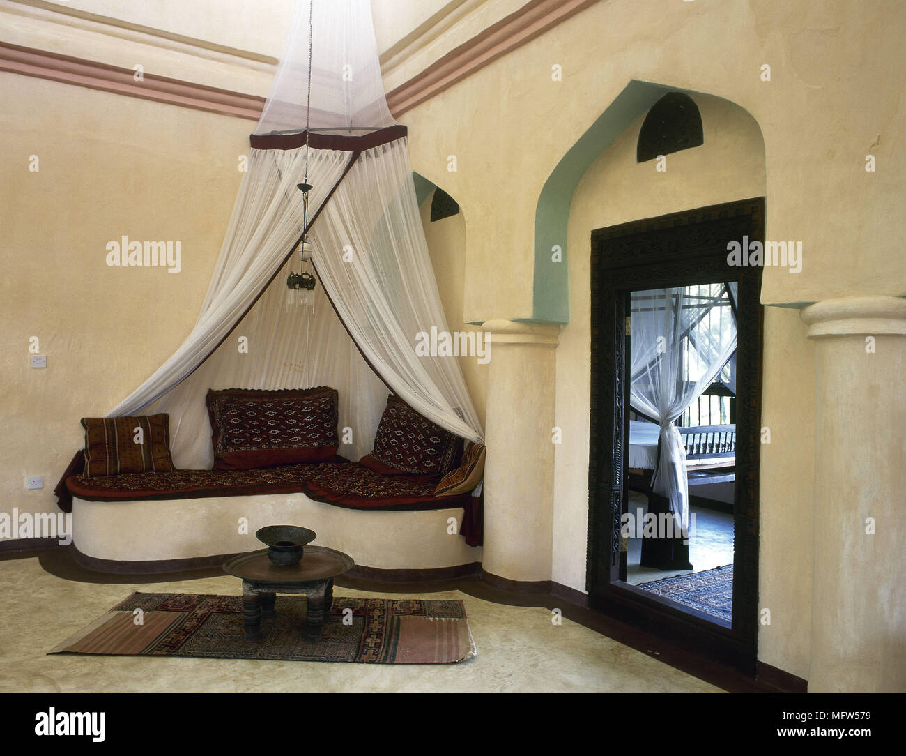 Seating in arabic style room with view through to bedroom Stock Photo ...