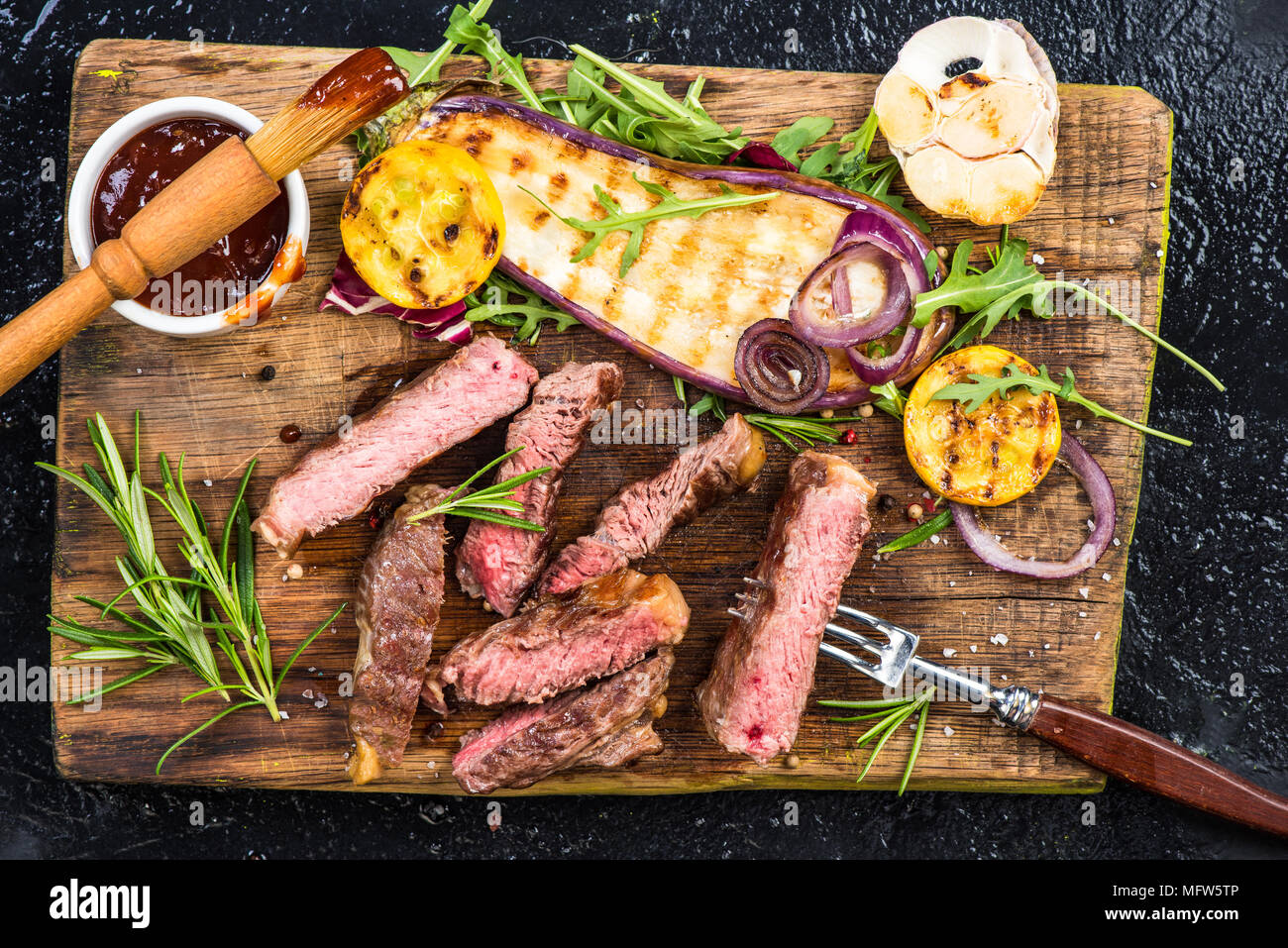 Barbecue grill meat with glaze and veggies Stock Photo - Alamy