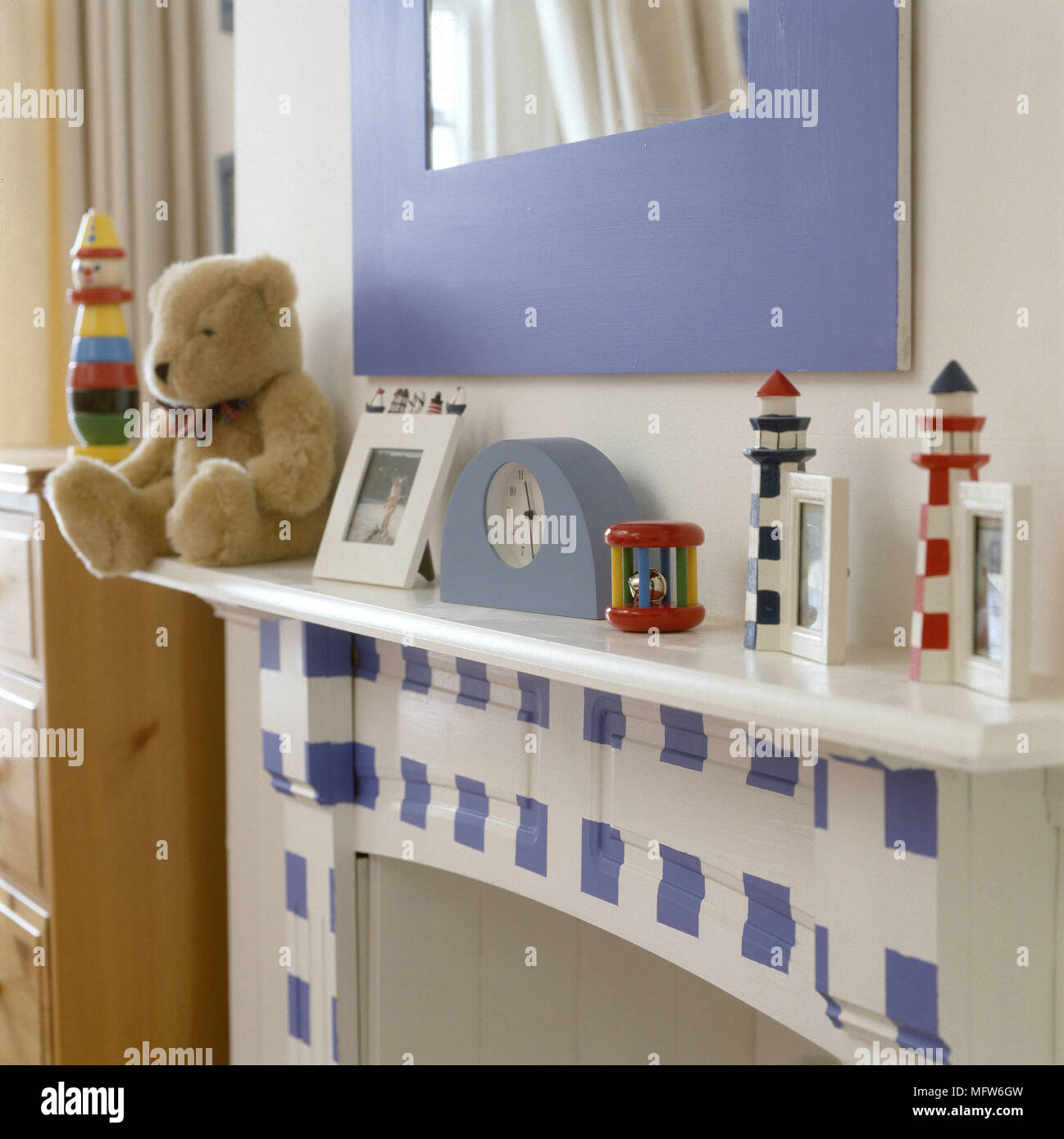 Child's bedroom detail with a decorative painted fireplace and a ...