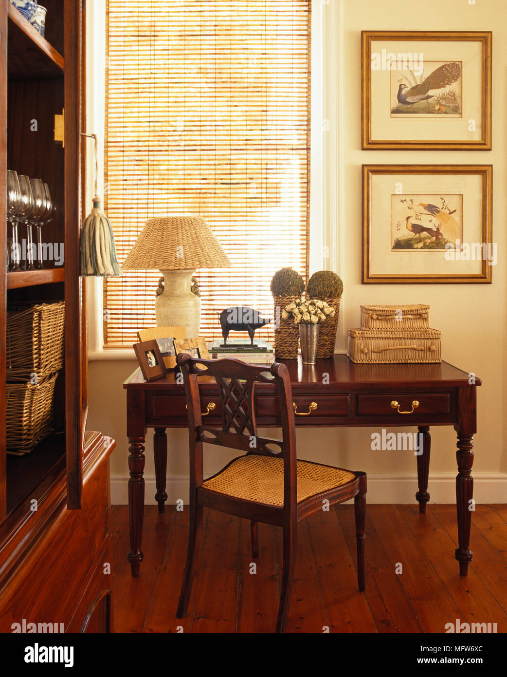 Period style writing table and chair beneath window Stock Photo - Alamy