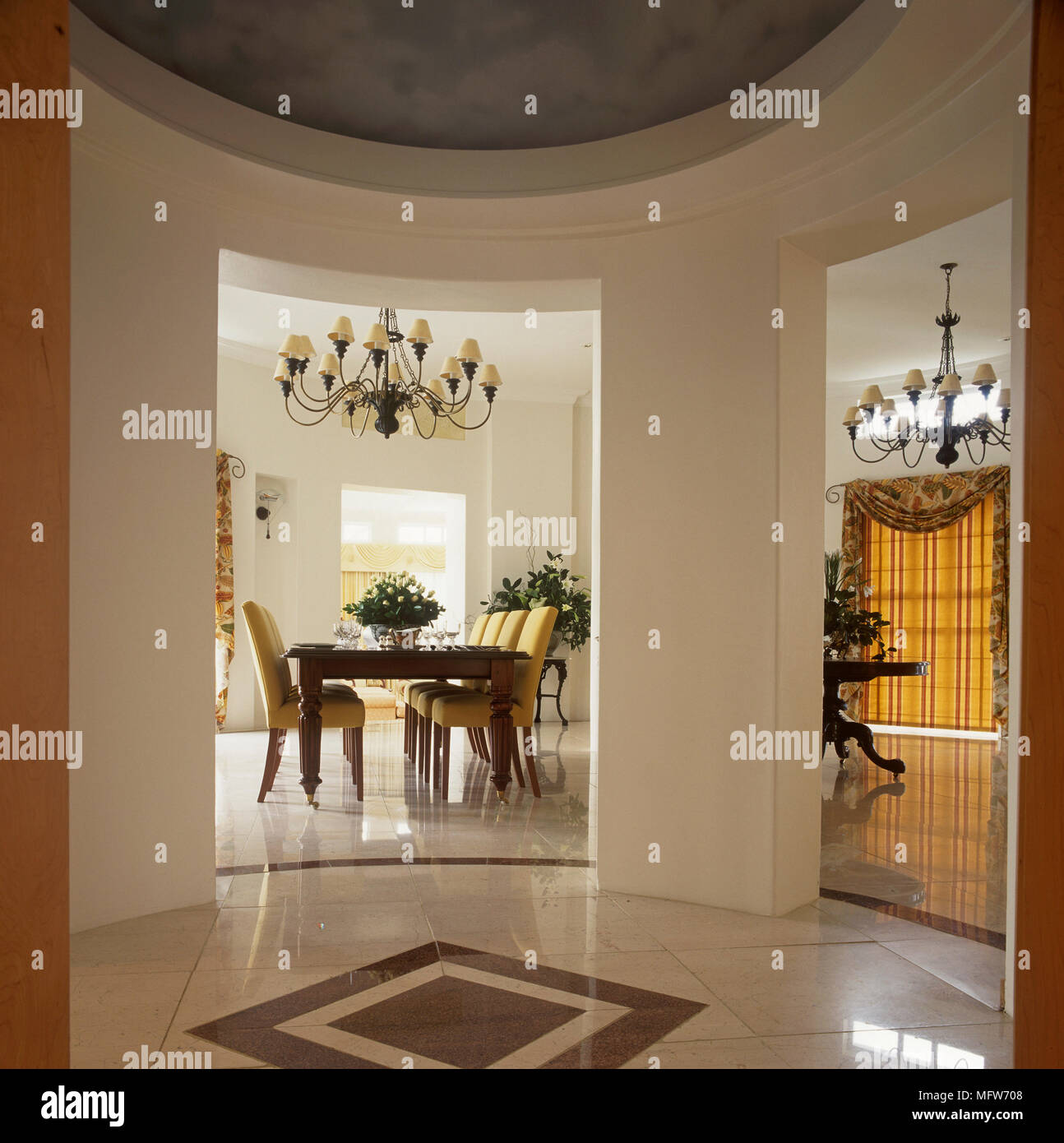 Round hallway with view through open door into dining room Stock Photo ...