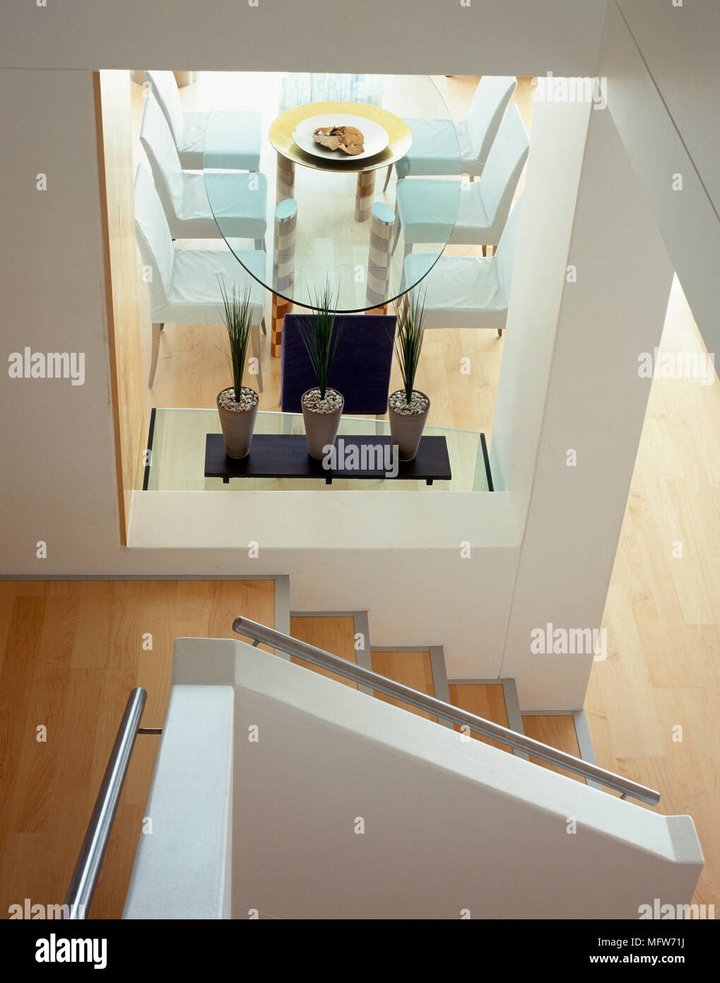 Elevated view of staircase with open window with view through to dining ...