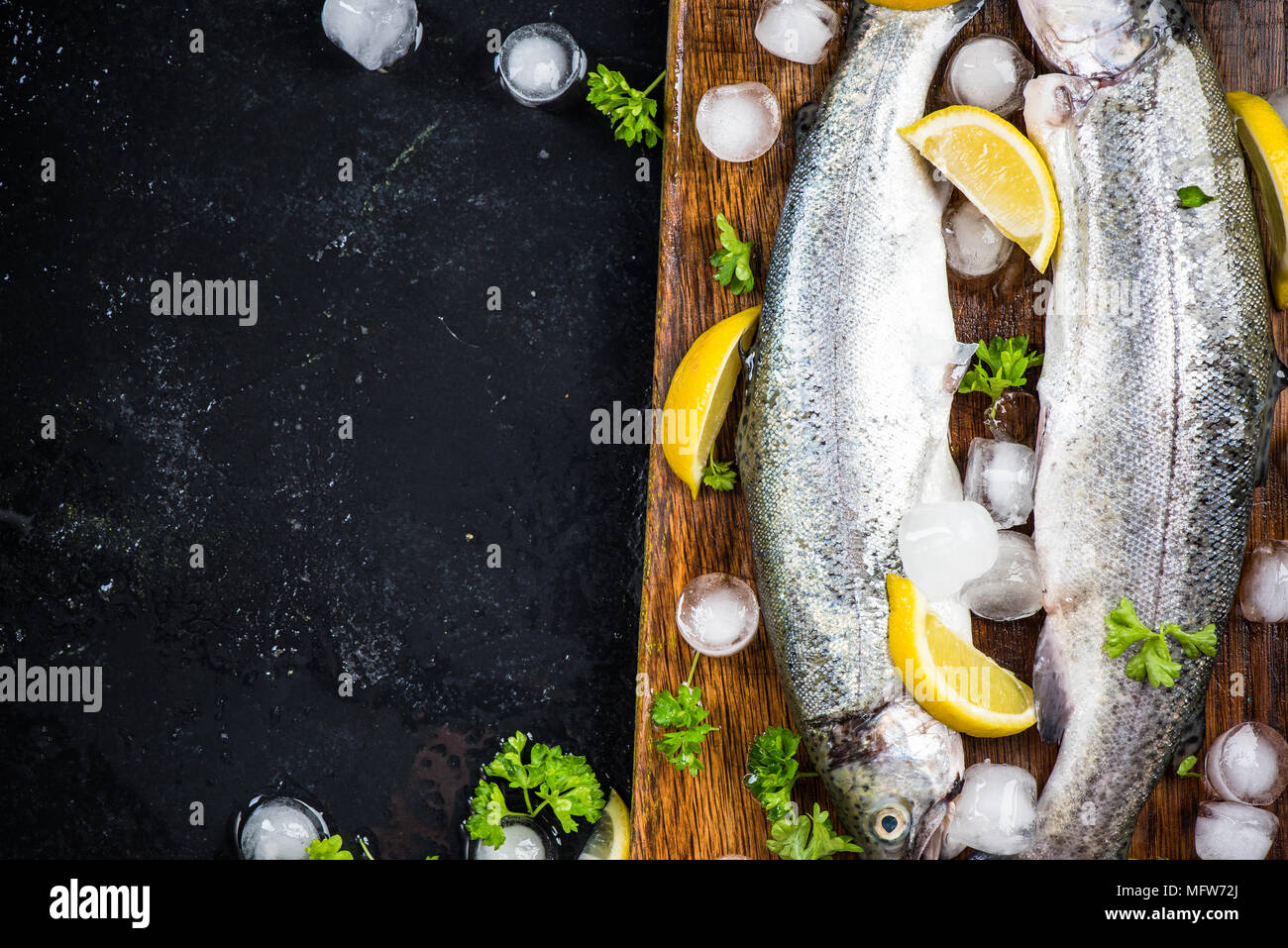 Fresh trout fish, food border background Stock Photo - Alamy