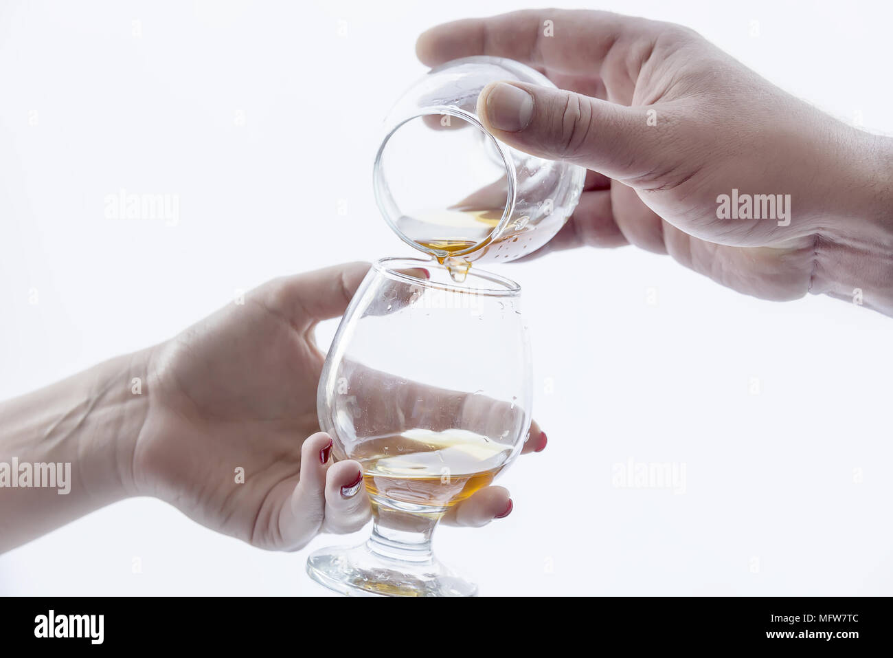 Hand pouring wine couple hi-res stock photography and images - Alamy