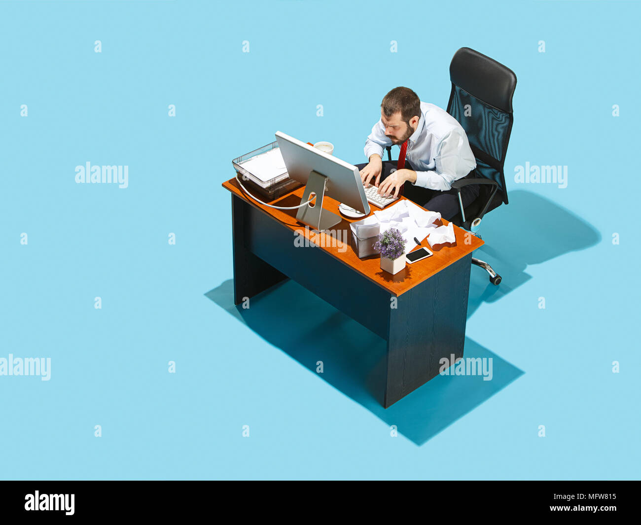 Shot from above of a stylish business man working on a laptop Stock ...