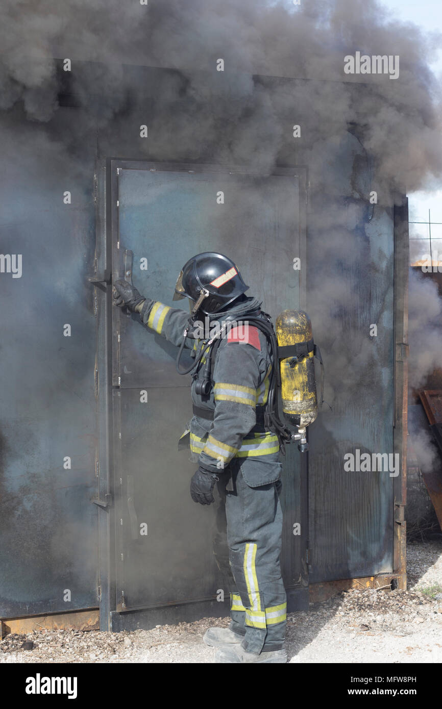 Firefighter putting out fire training station extinguisher backdraft ...