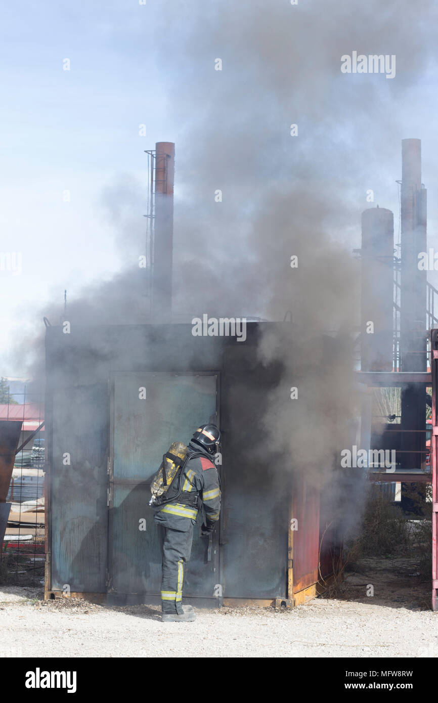 Firefighter putting out fire training station extinguisher backdraft ...