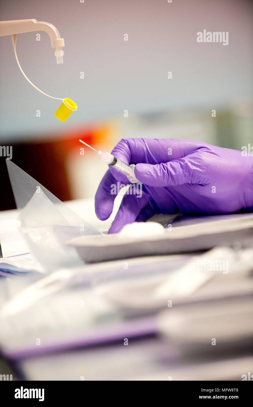 A syringe being prepared in a hospital treatment room Stock Photo - Alamy