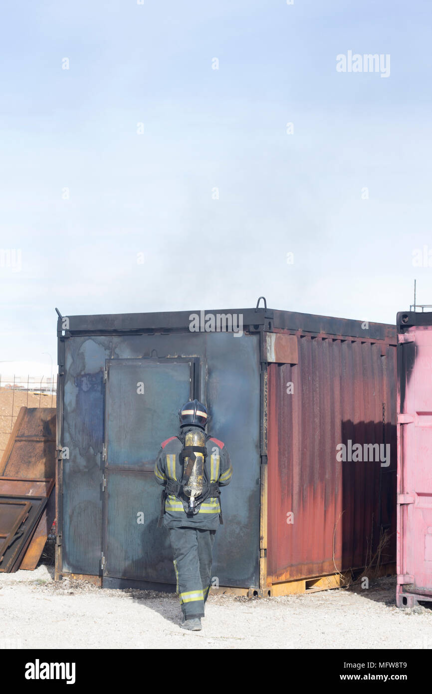 Firefighter putting out fire training station extinguisher backdraft ...