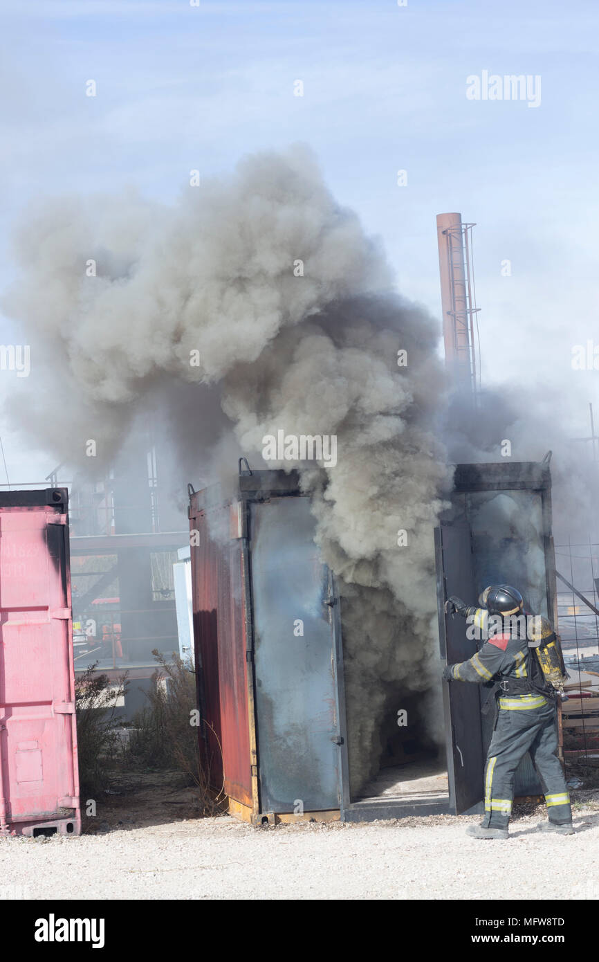 Firefighter putting out fire training station extinguisher backdraft ...
