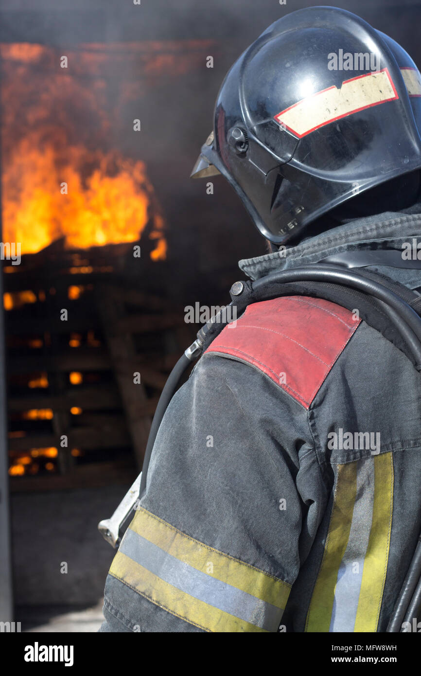 Firefighter putting out fire training station extinguisher backdraft ...