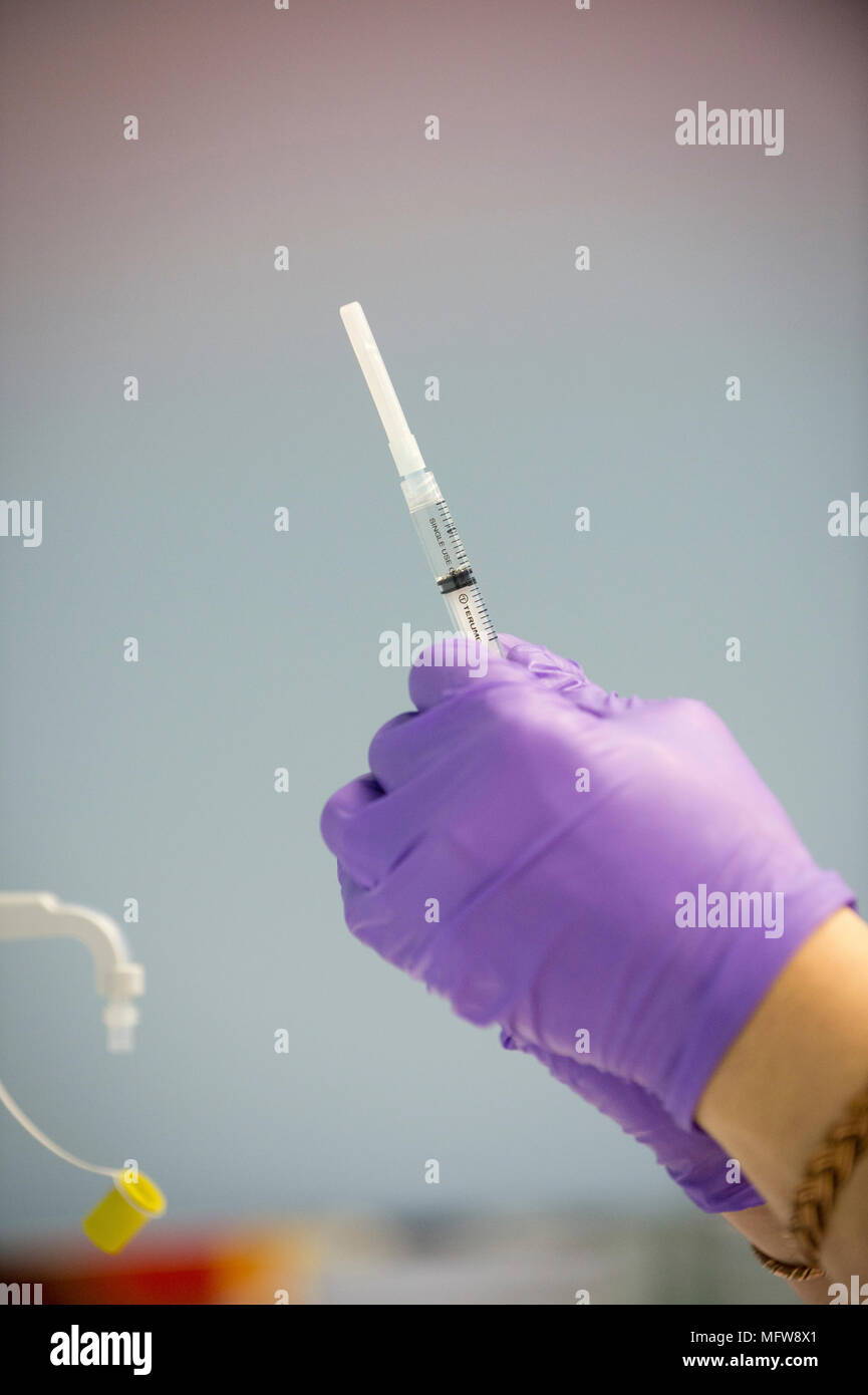 A syringe being prepared in a hospital treatment room Stock Photo - Alamy