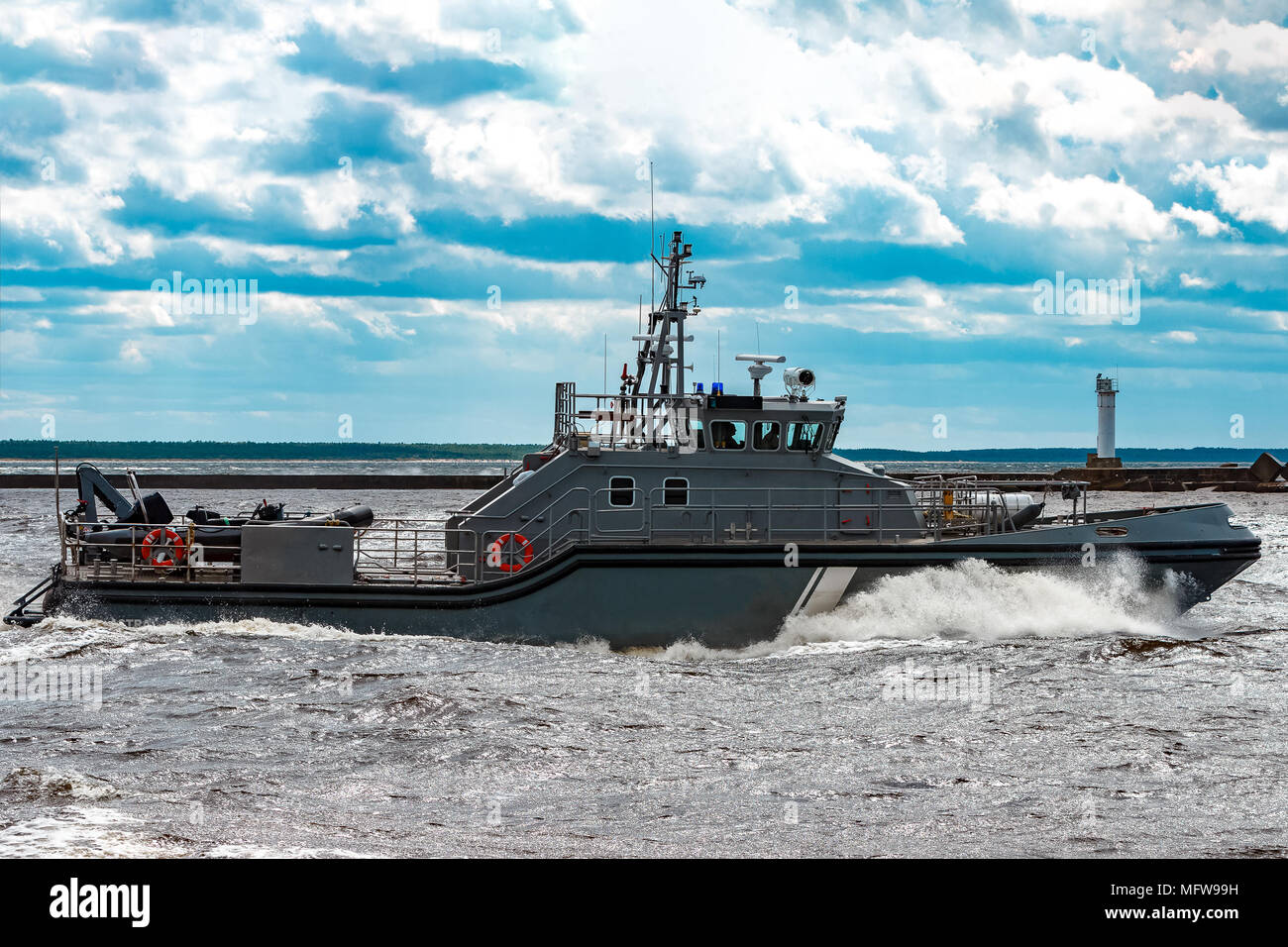 Grey military ship sailing at Baltic sea. Border guard service Stock ...