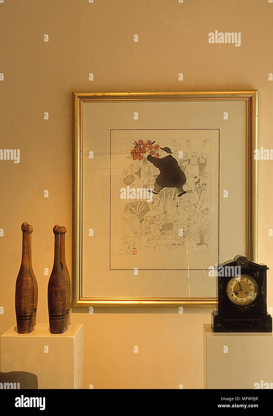 Skittles and clock on plinths either side of artwork Stock Photo - Alamy