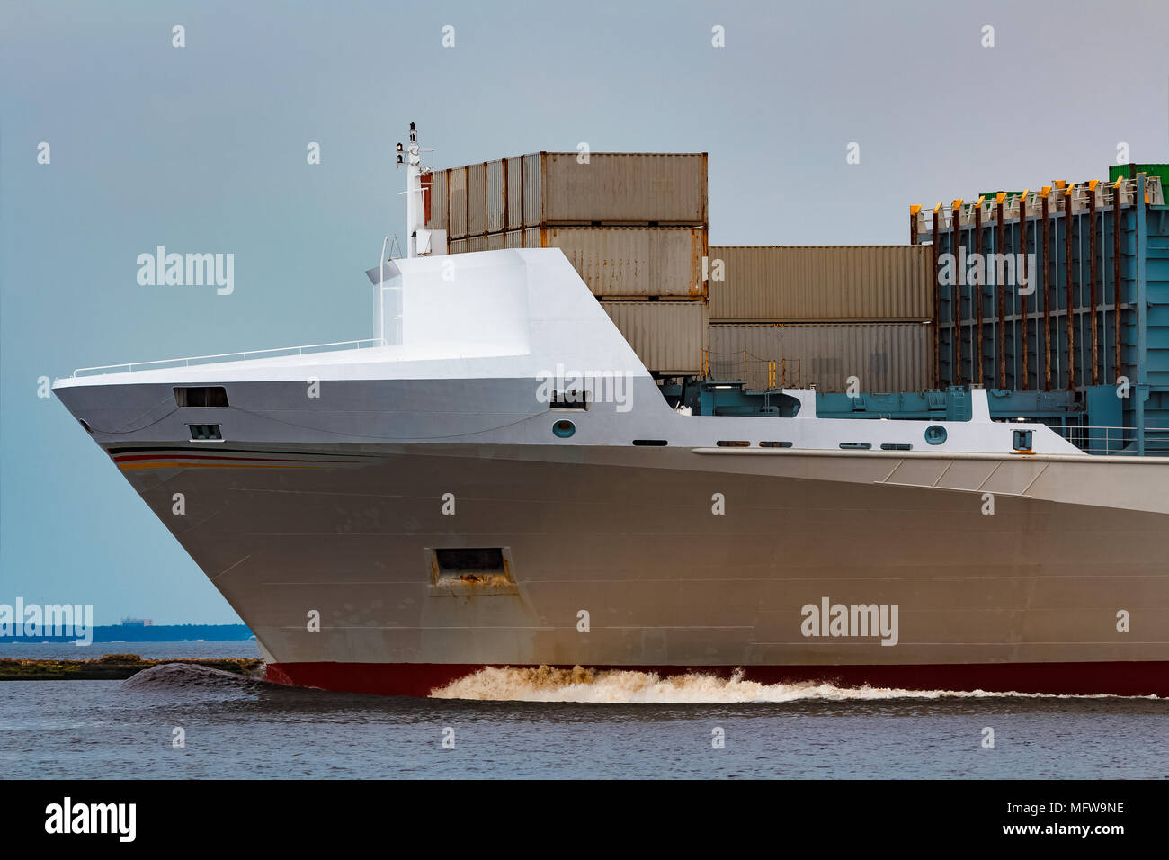 Grey container ship. Logistics and production import Stock Photo - Alamy