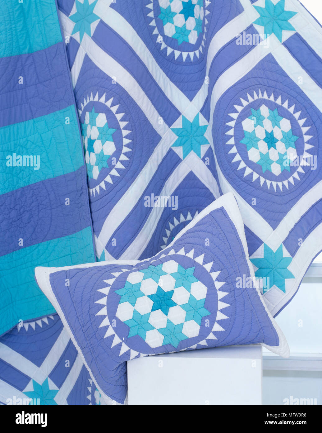 Blue patchwork blankets and pillow Stock Photo - Alamy