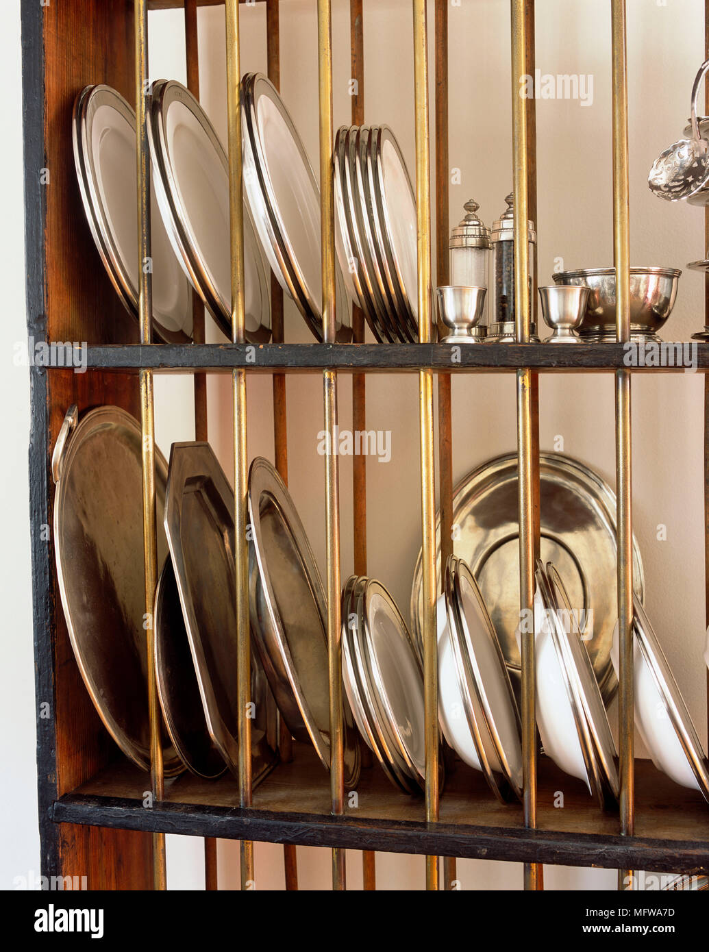 Detail of rack of crockery and silverware Stock Photo - Alamy