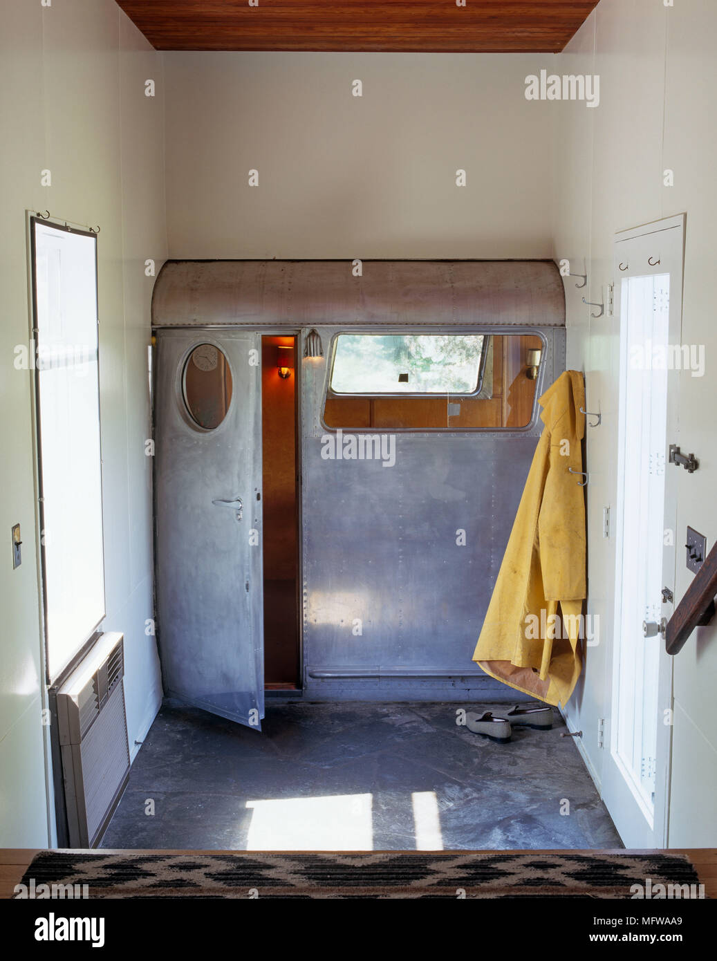 Elevated view of front door entrance in rustic metal pod Stock Photo ...