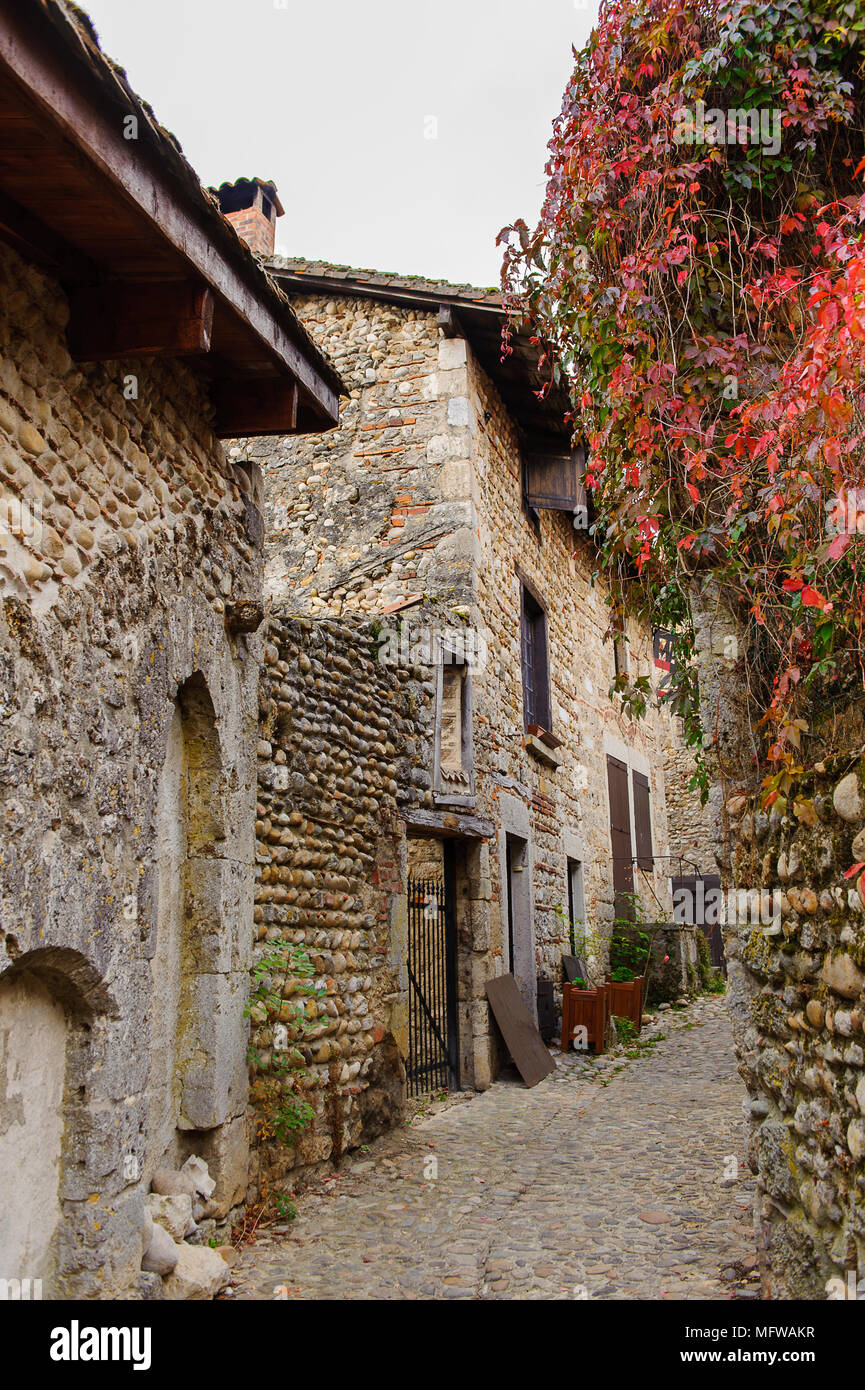 Narrow street in Perouges, France, a medieval walled town, a popular ...