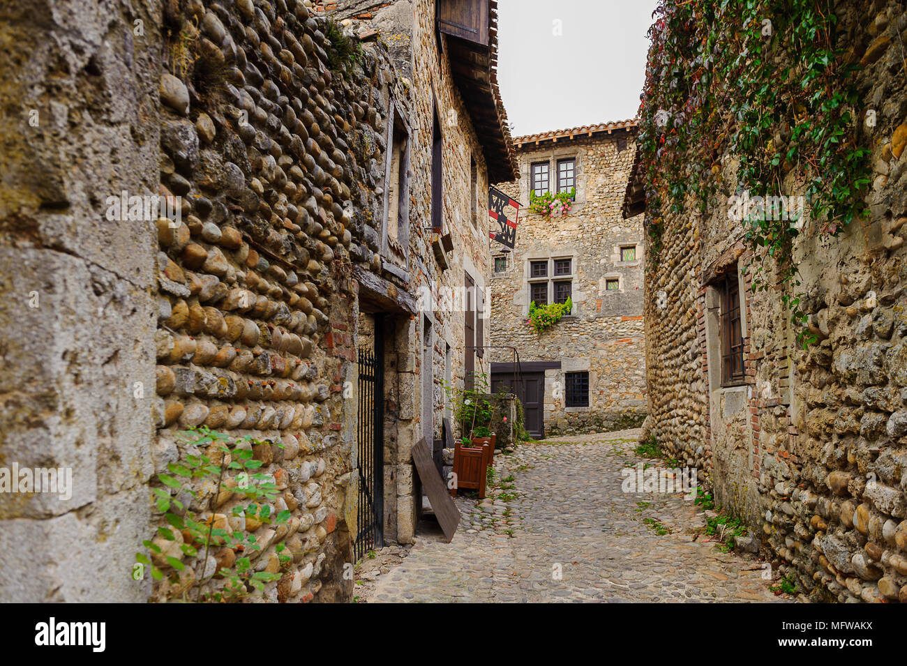 Narrow street in Perouges, France, a medieval walled town, a popular ...