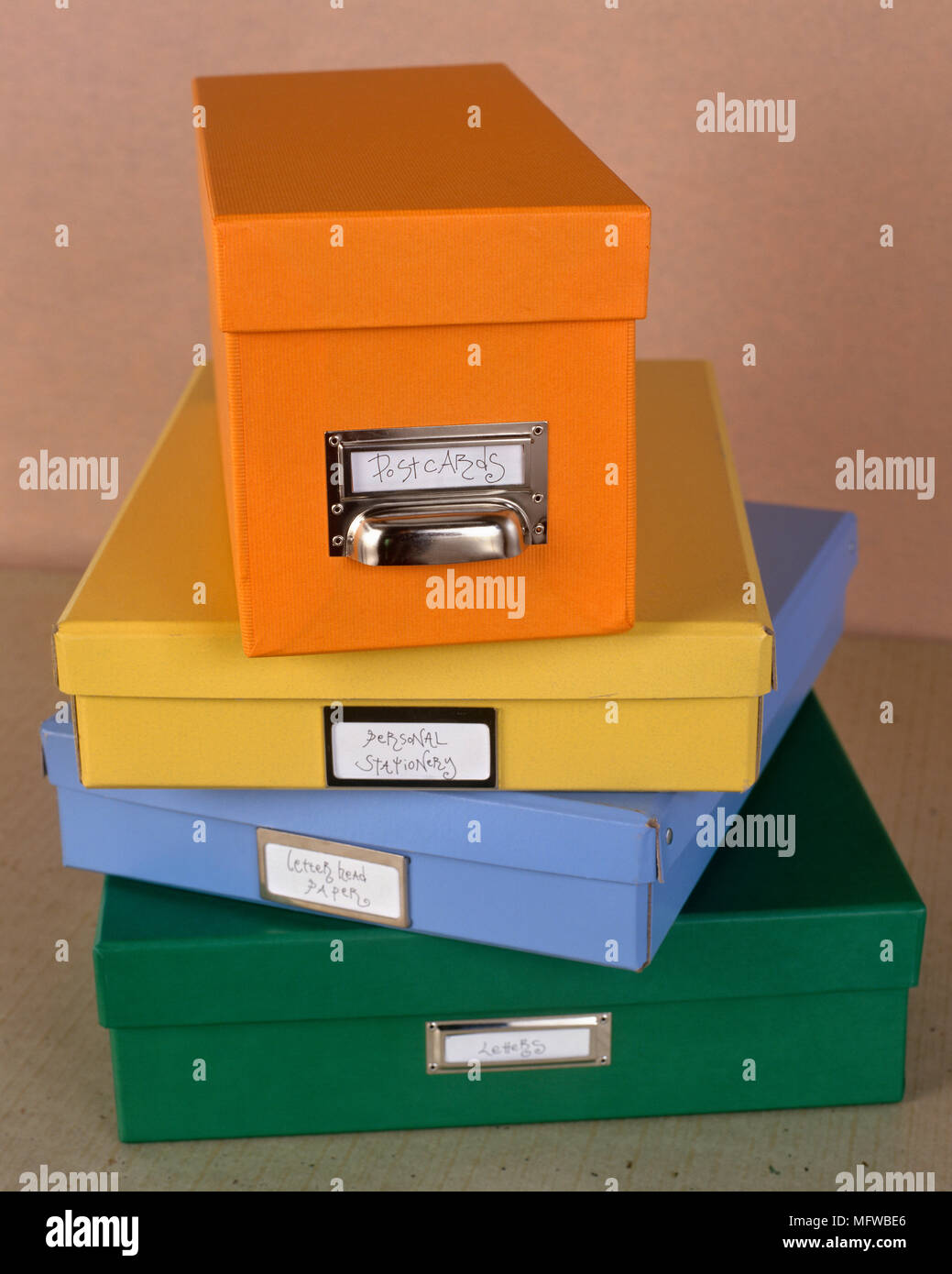 Stack of colourful storage boxes Stock Photo - Alamy