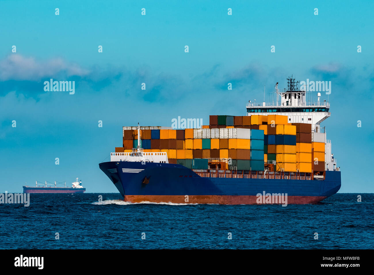 Blue container ship in travel. Logistics and freight industry Stock ...