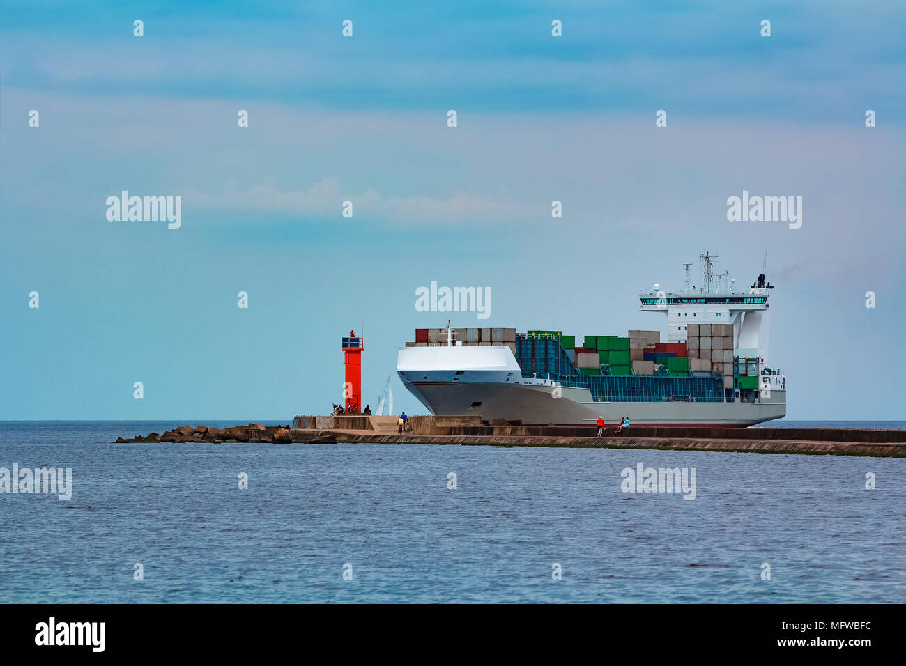 Grey container ship. Logistics and production import Stock Photo - Alamy
