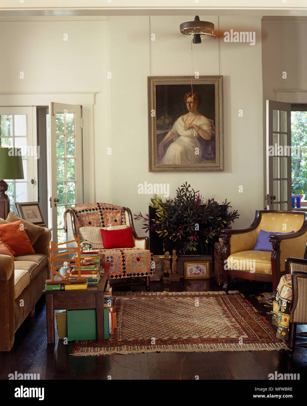 Upholstered seating arranged around rug Stock Photo - Alamy