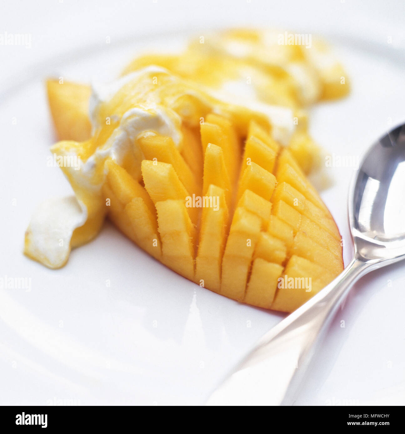 Fresh mango and cream Stock Photo - Alamy