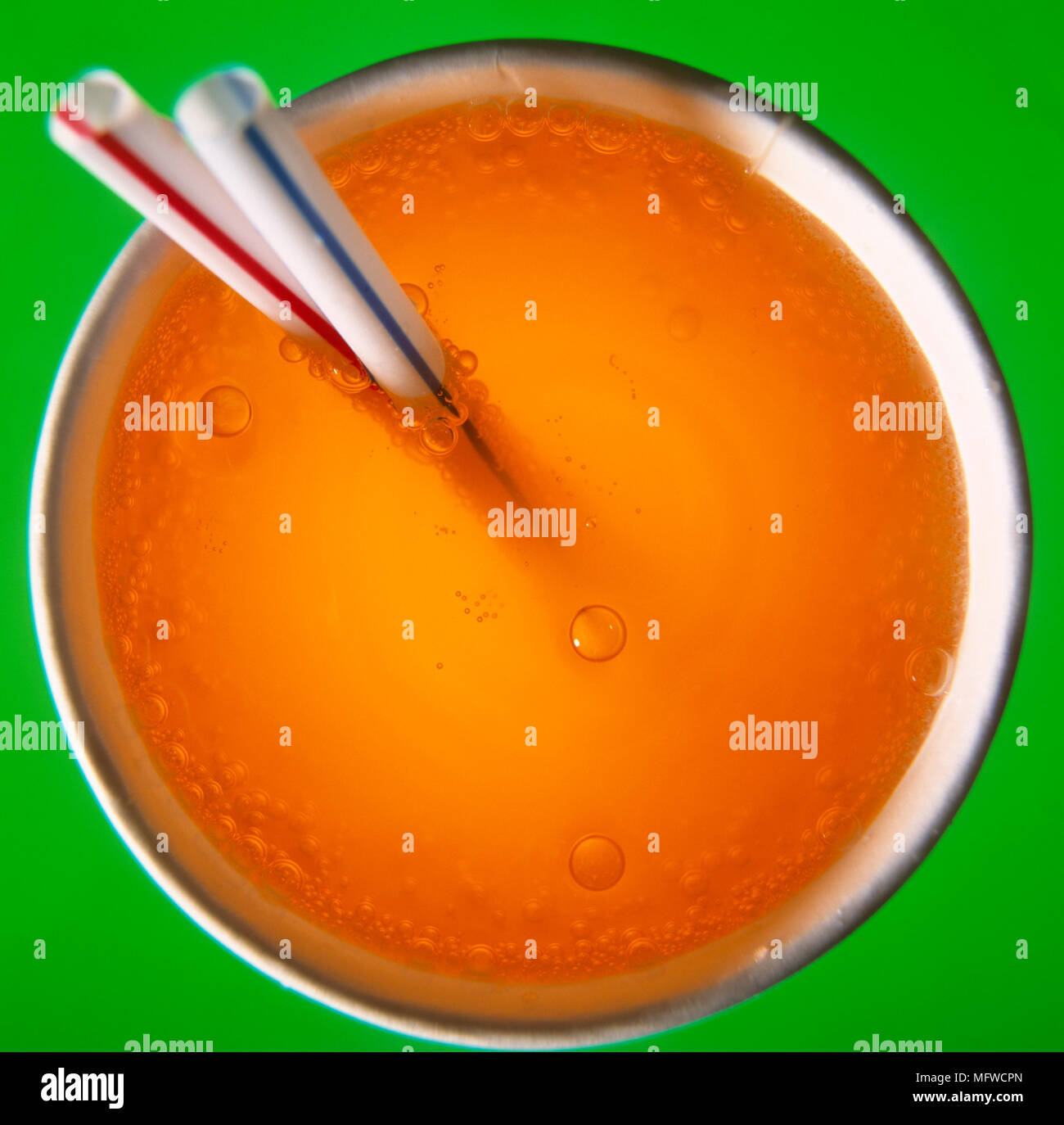 Orange fizzy drink with straws Stock Photo - Alamy