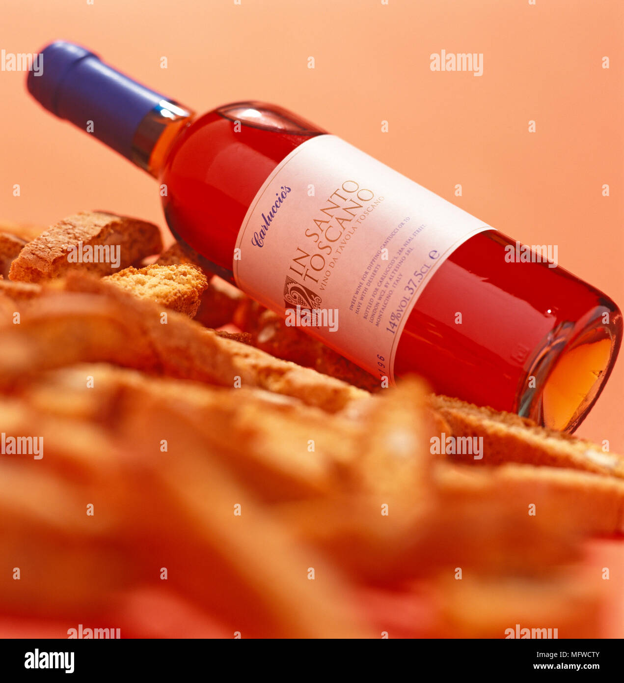 Bottle of Italian red wine resting on biscuits Stock Photo - Alamy