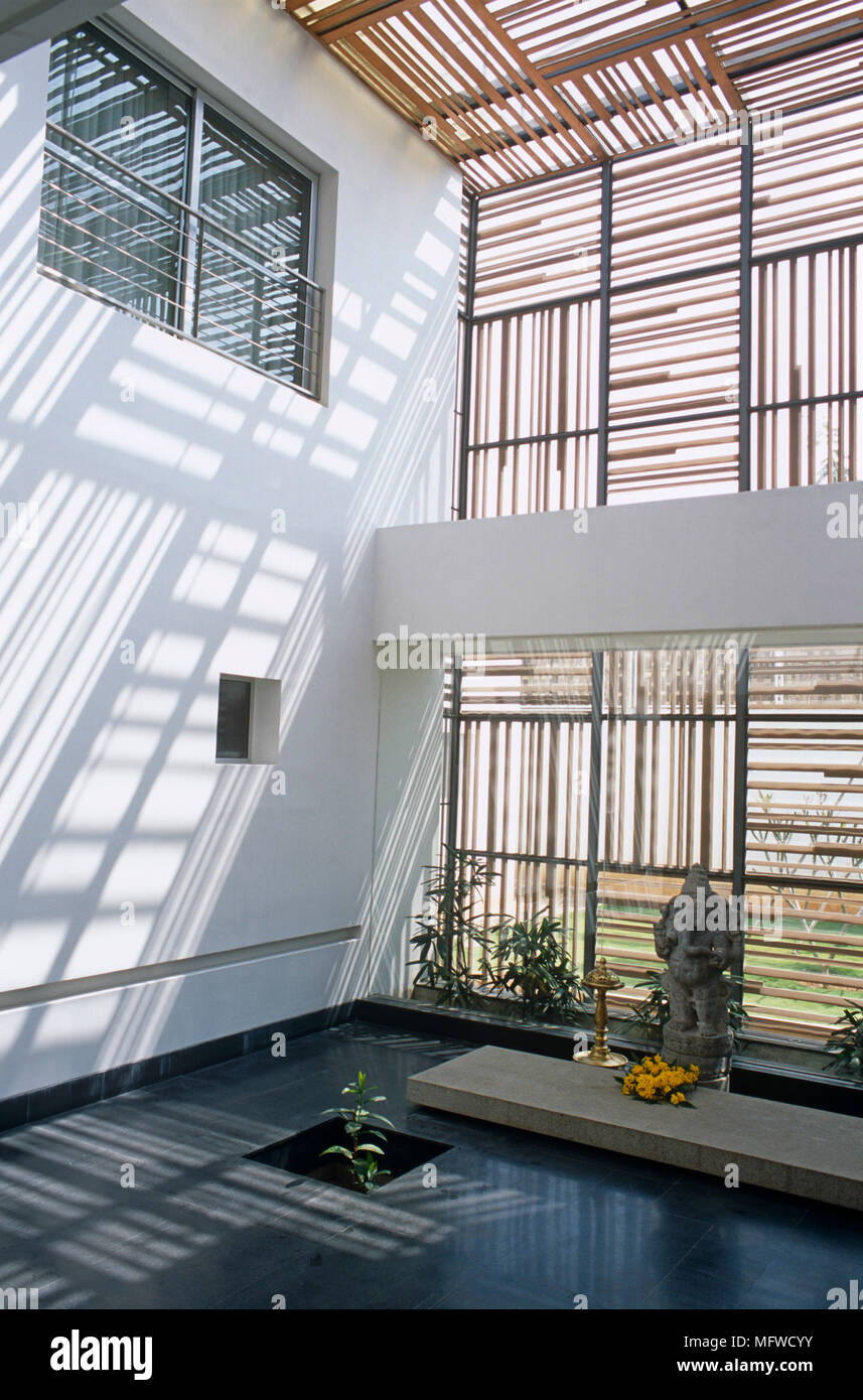 Light filtering through window panels into ethnic styled room Stock ...