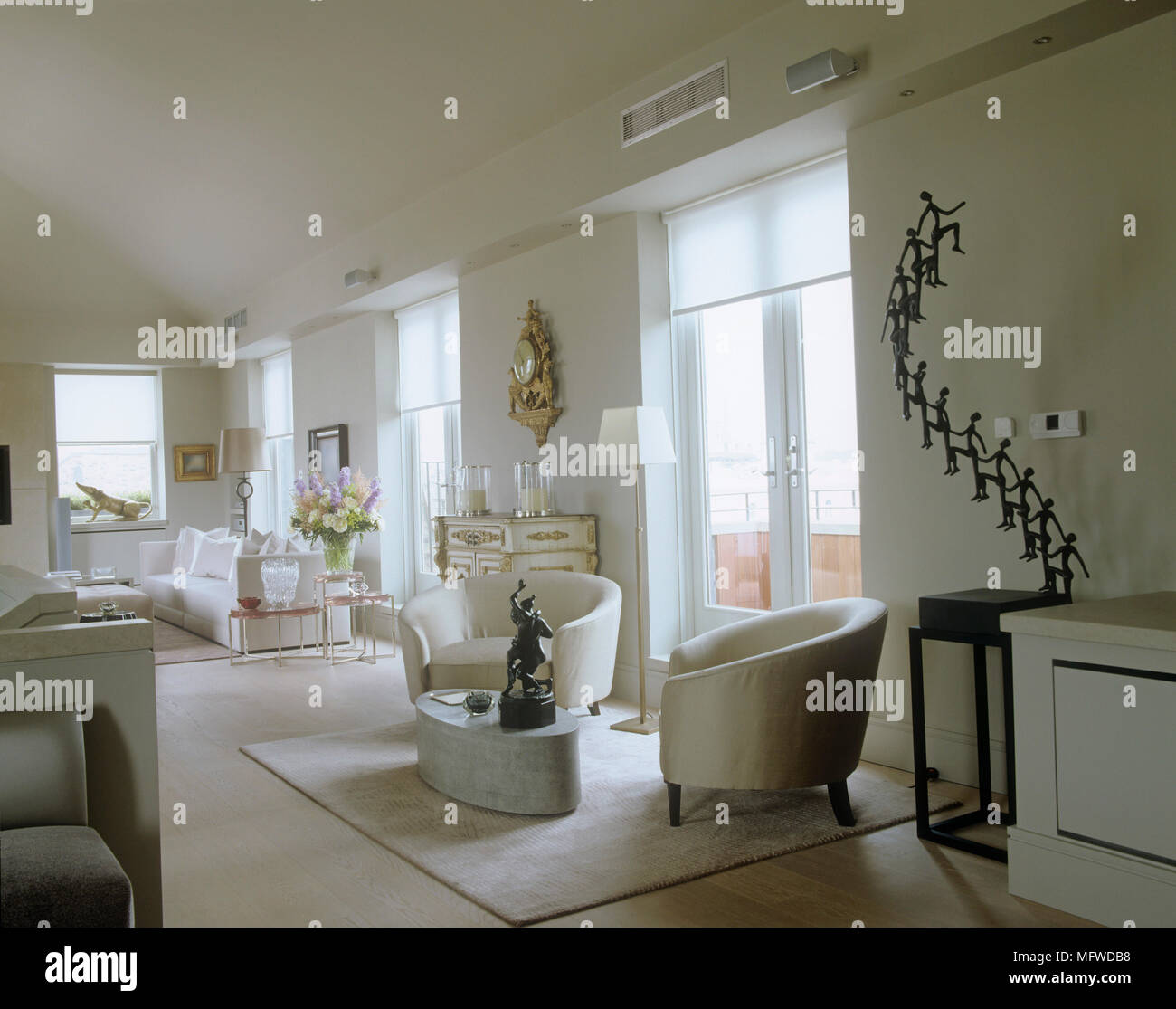 Open plan sitting room with modern ornaments and furniture Stock Photo ...