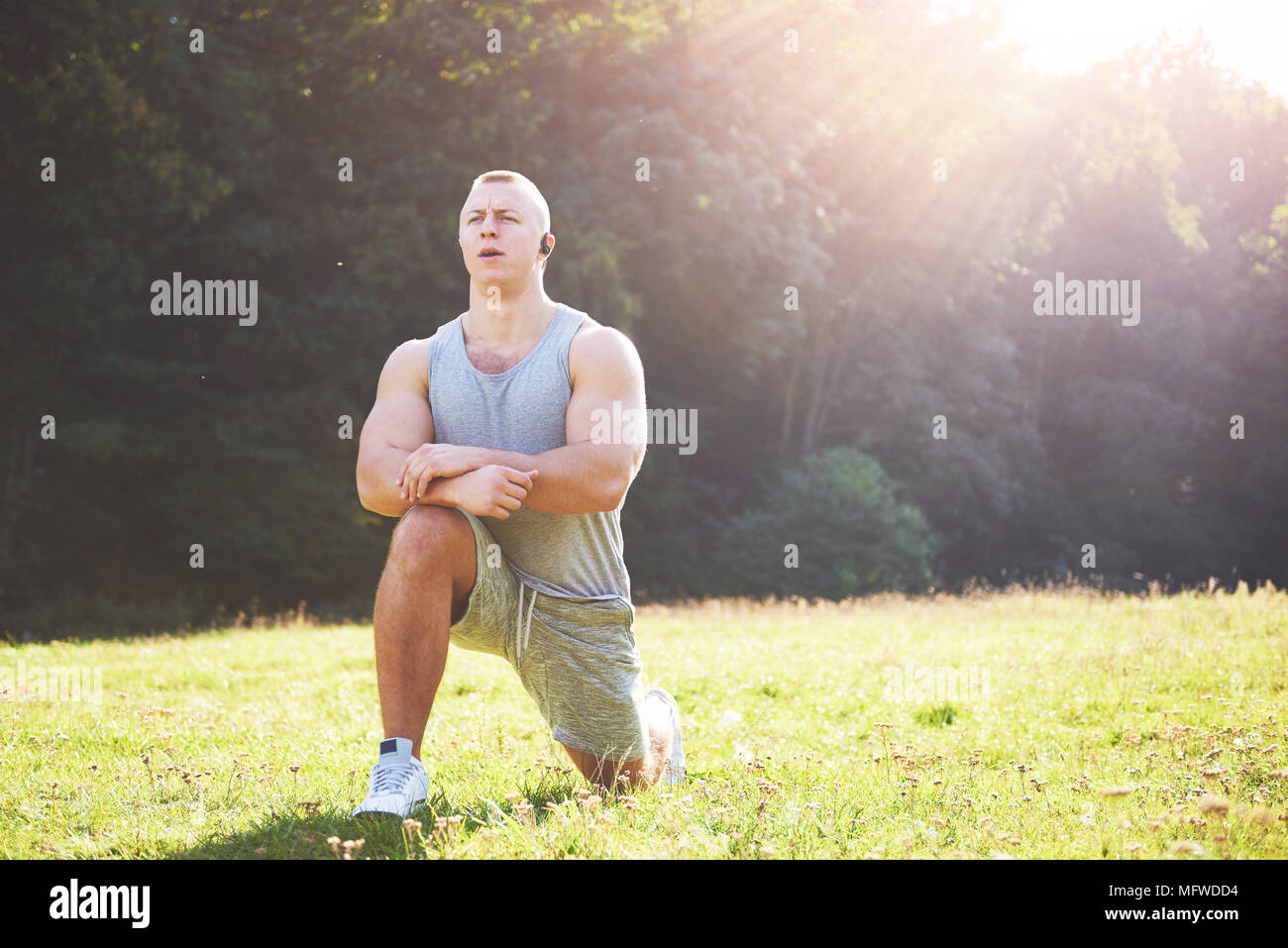 A young sportsman getting ready for athletic and fitness training ...
