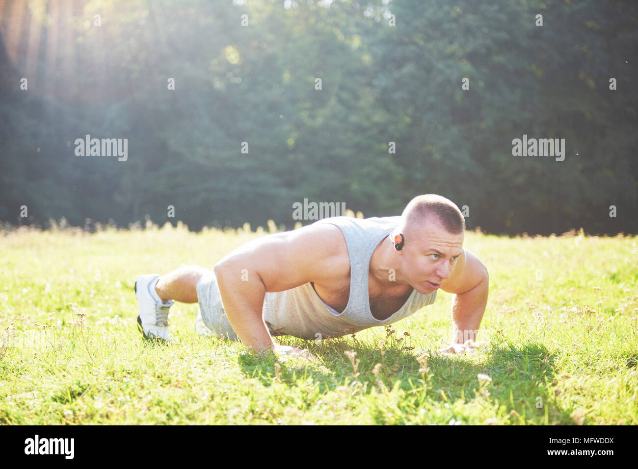 A young sportsman getting ready for athletic and fitness training ...