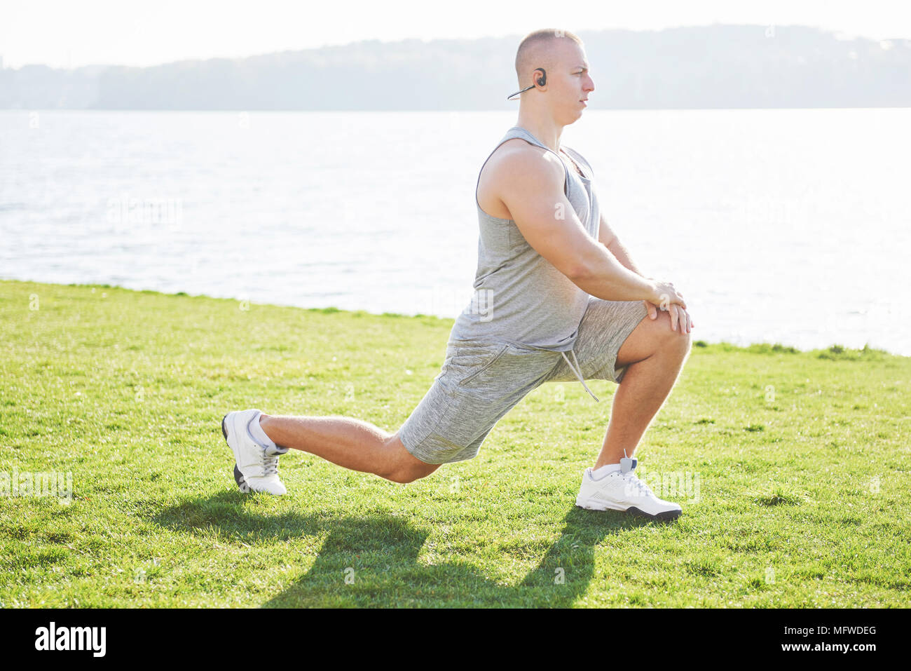 A young sportsman getting ready for athletic and fitness training ...