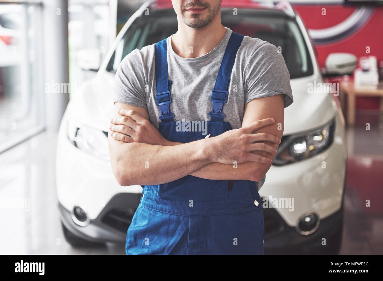 Hand of car mechanic with wrench. Auto repair garage Stock Photo - Alamy
